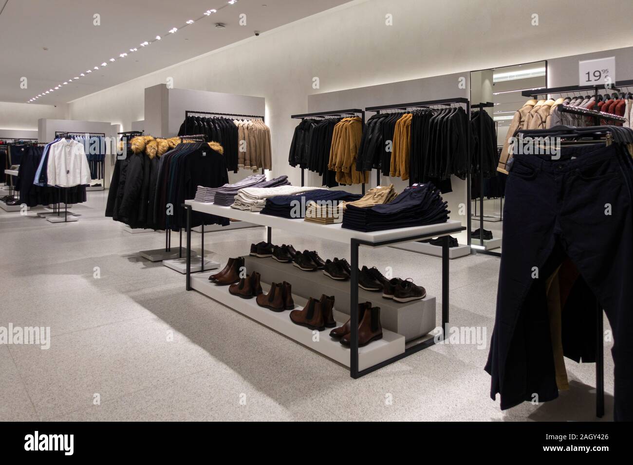 Modern fashionable brand interior of clothing store inside shopping ...