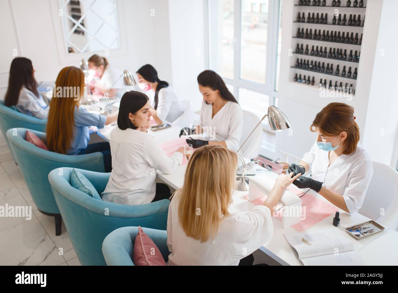 Group of girlfriends, manicure in beauty salon Stock Photo - Alamy