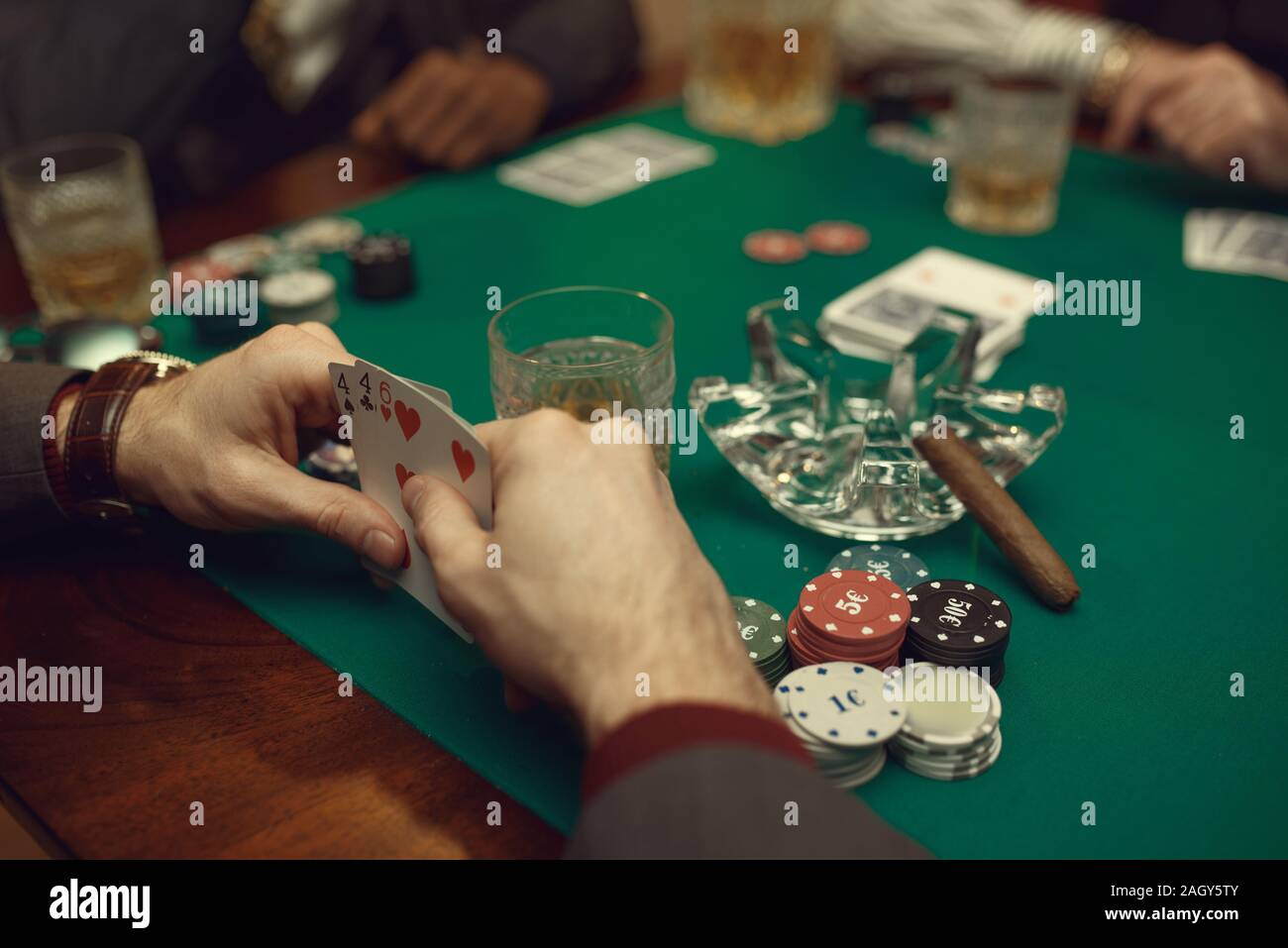 People playing poker table hi-res stock photography and images - Alamy