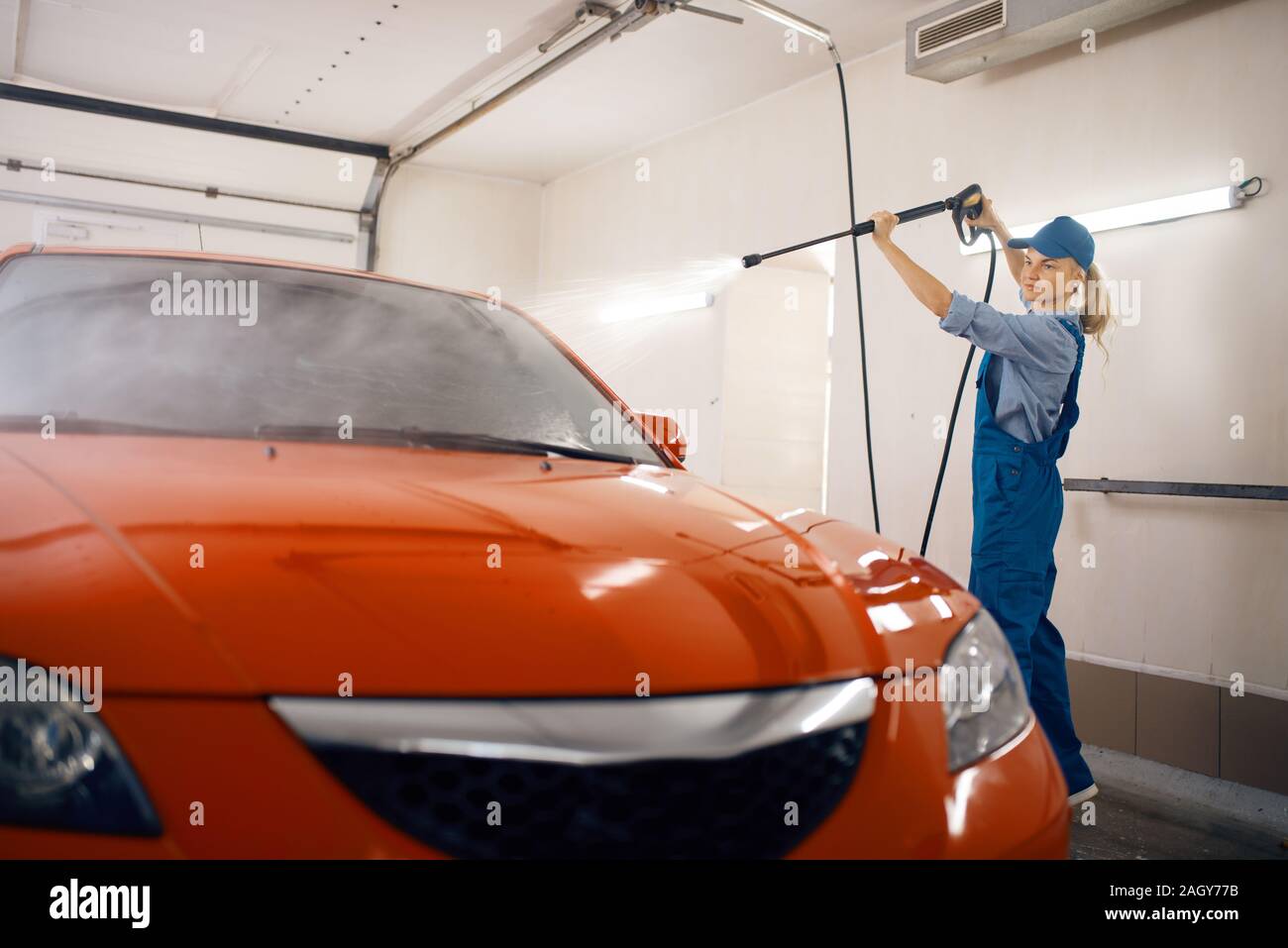 Washer with high pressure gun, car wash service Stock Photo - Alamy