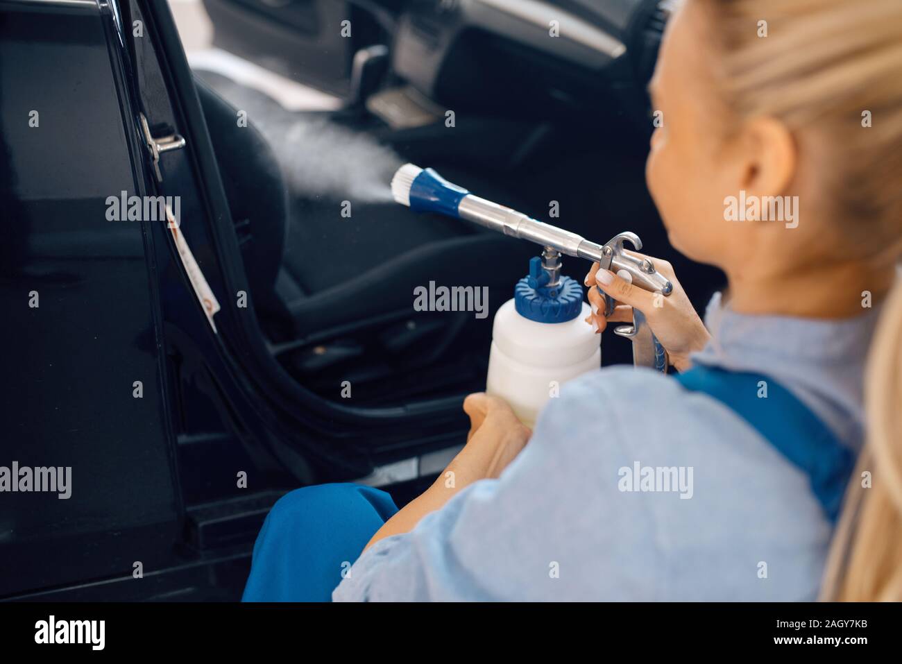 Female hand cleaning auto interior hi-res stock photography and images ...