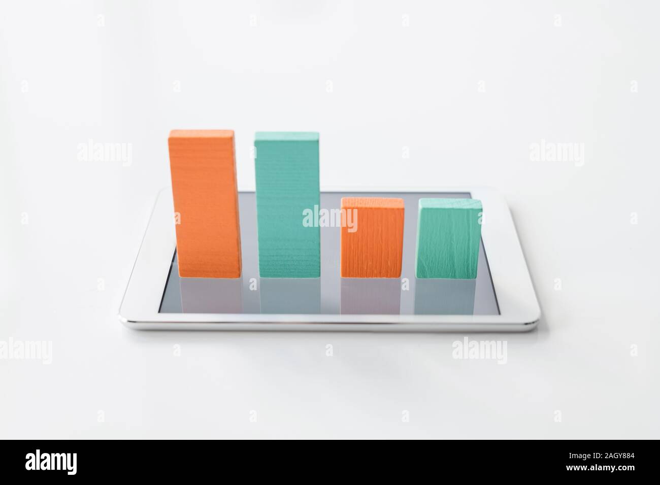 Colorful chart made up of flat wooden bricks standing in row on screen ...