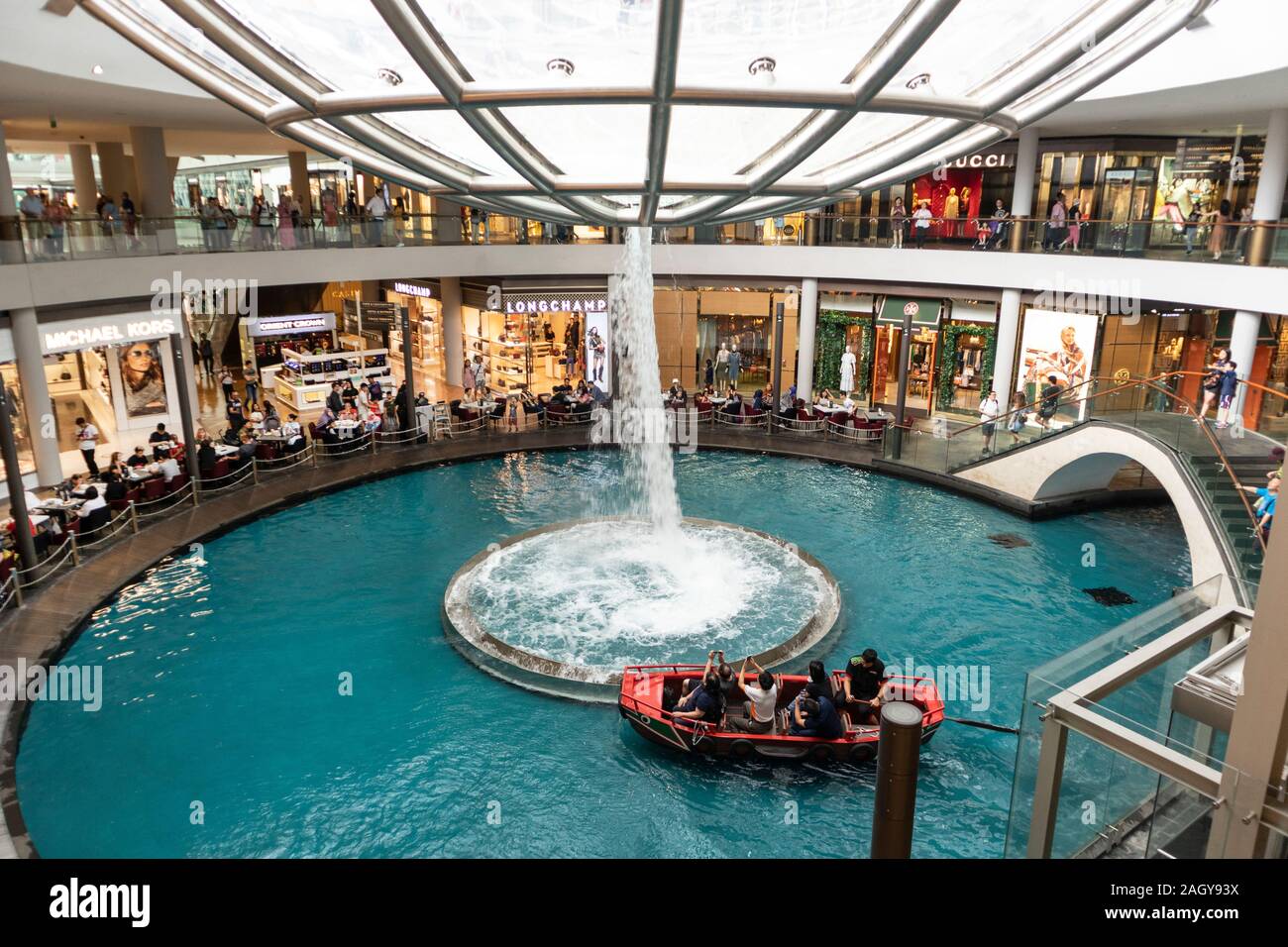 Boats on the internal canal at the Marina Bay Sands shopping Mall in ...