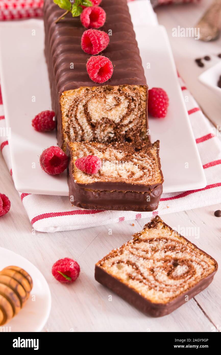 Marble cake with raspberries Stock Photo - Alamy