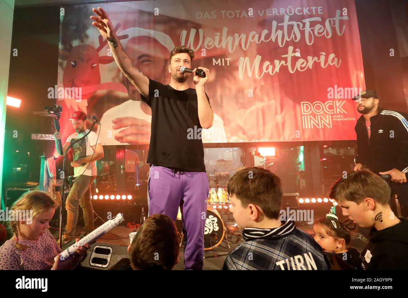 Rostock, Germany. 22nd Dec, 2019. The rapper Marteria (l) is on stage ...