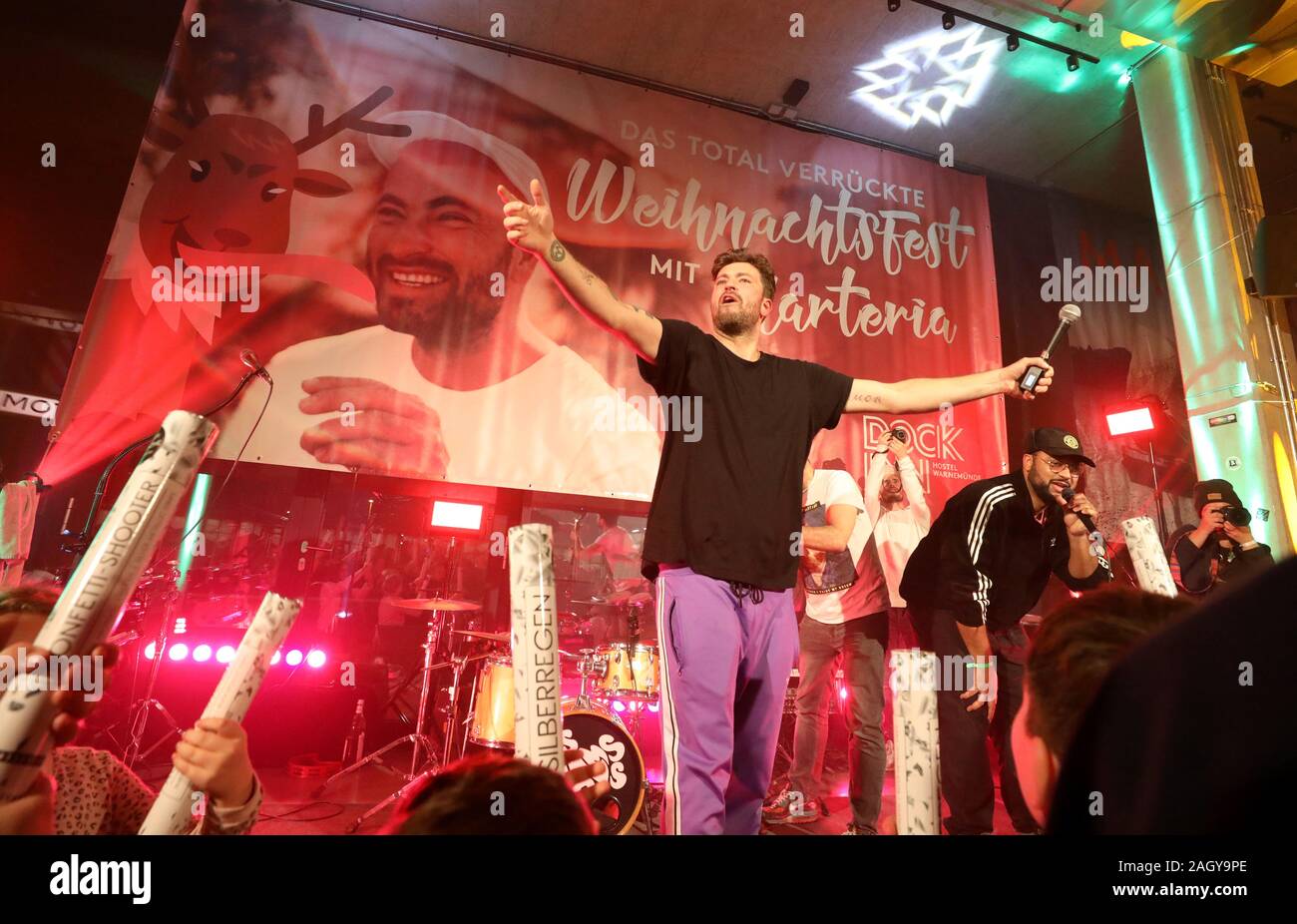 Rostock, Germany. 22nd Dec, 2019. The rapper Marteria (l) is on stage ...