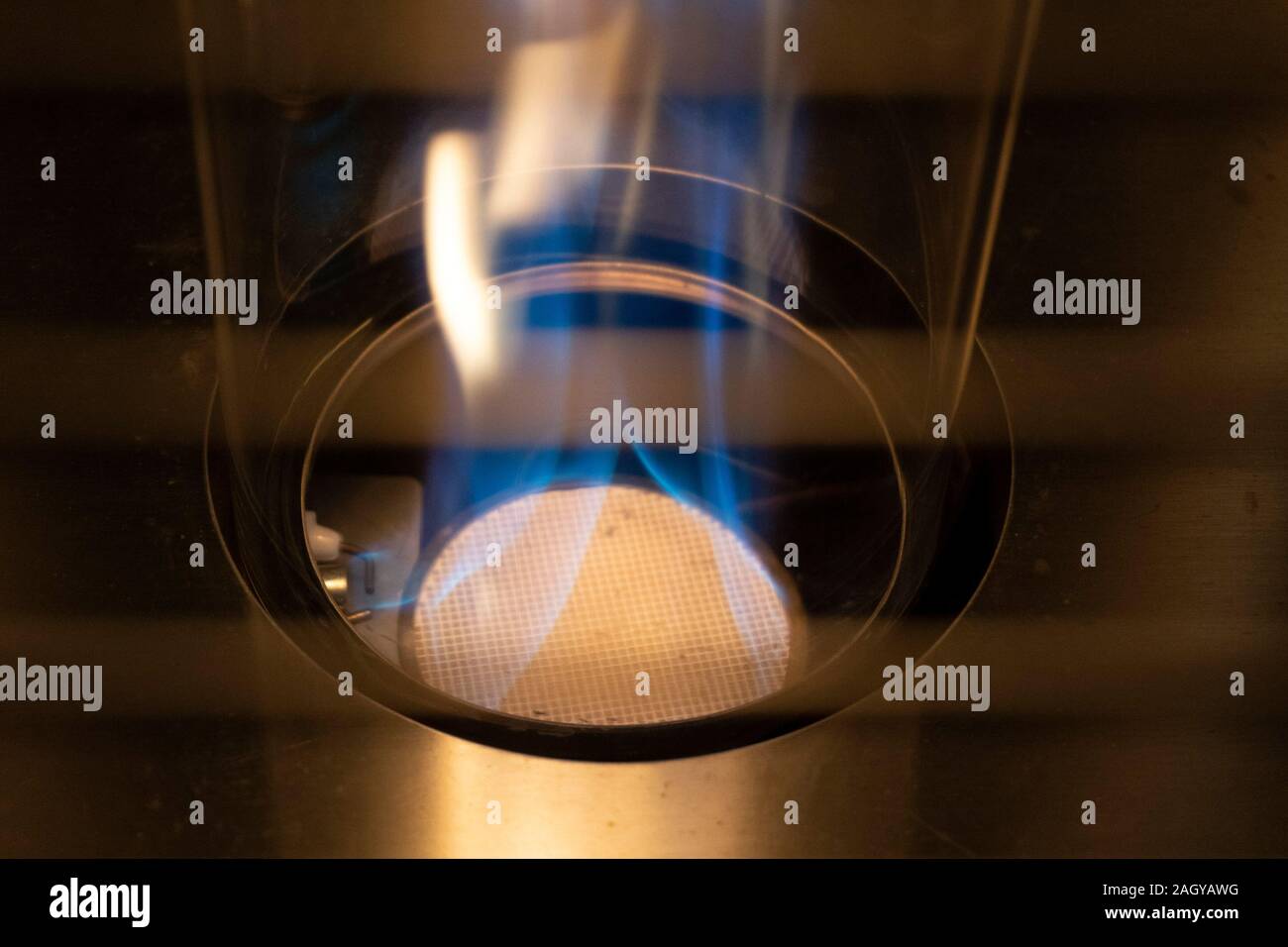 Gas heater detail with flame Stock Photo - Alamy