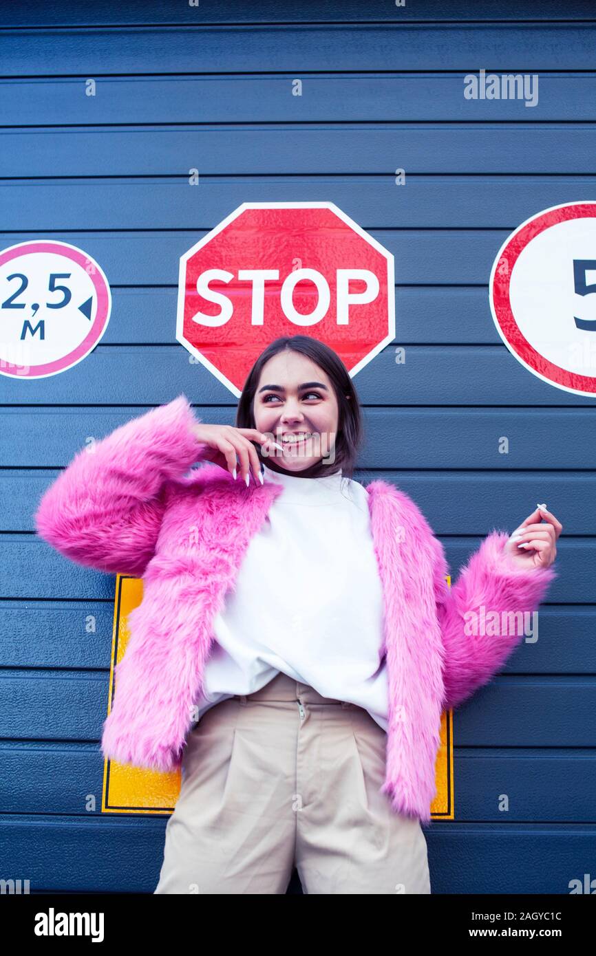 young cute girl teenager gesturing hanging around city parking and ...