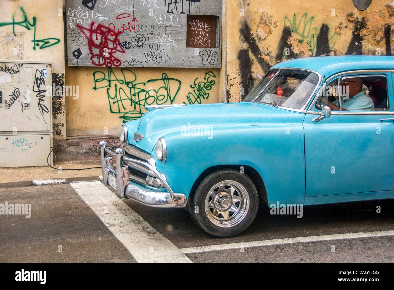 A turquoise colored, classic car from the 1950's, in the Old Town part ...