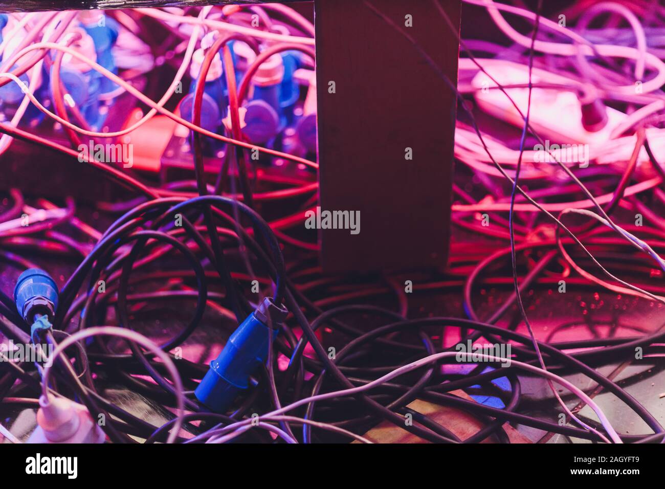 The bunch of electric wires of different colors are very much ...