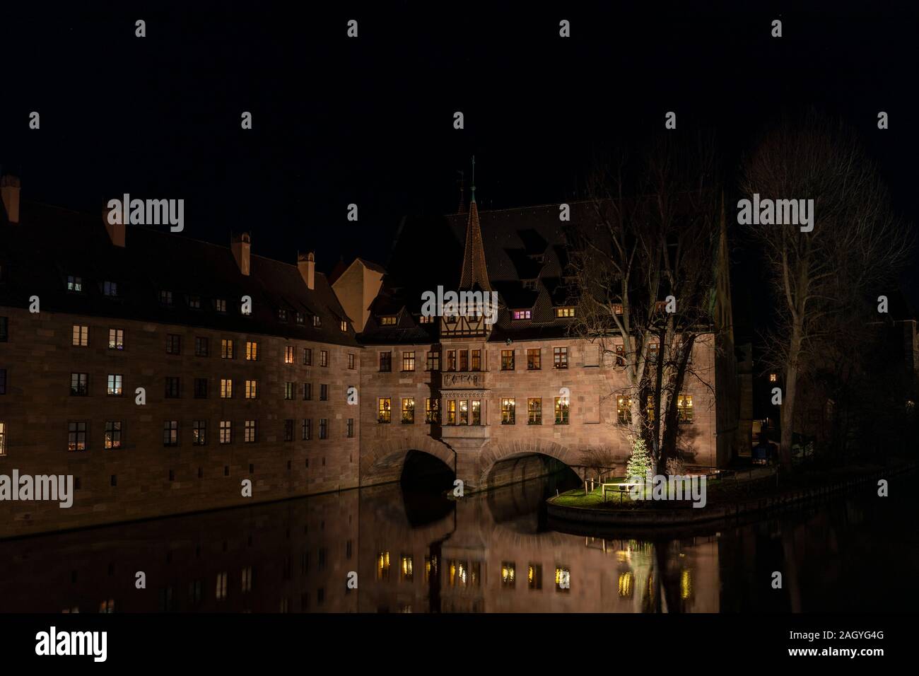 Historical buildings dramatically illuminated during night time. Old ...