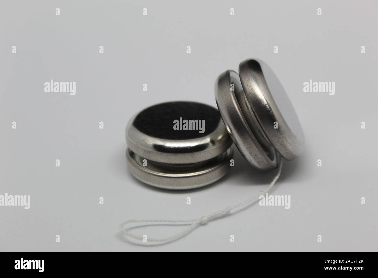 Two Small Metal Yo-yos Stock Photo - Alamy