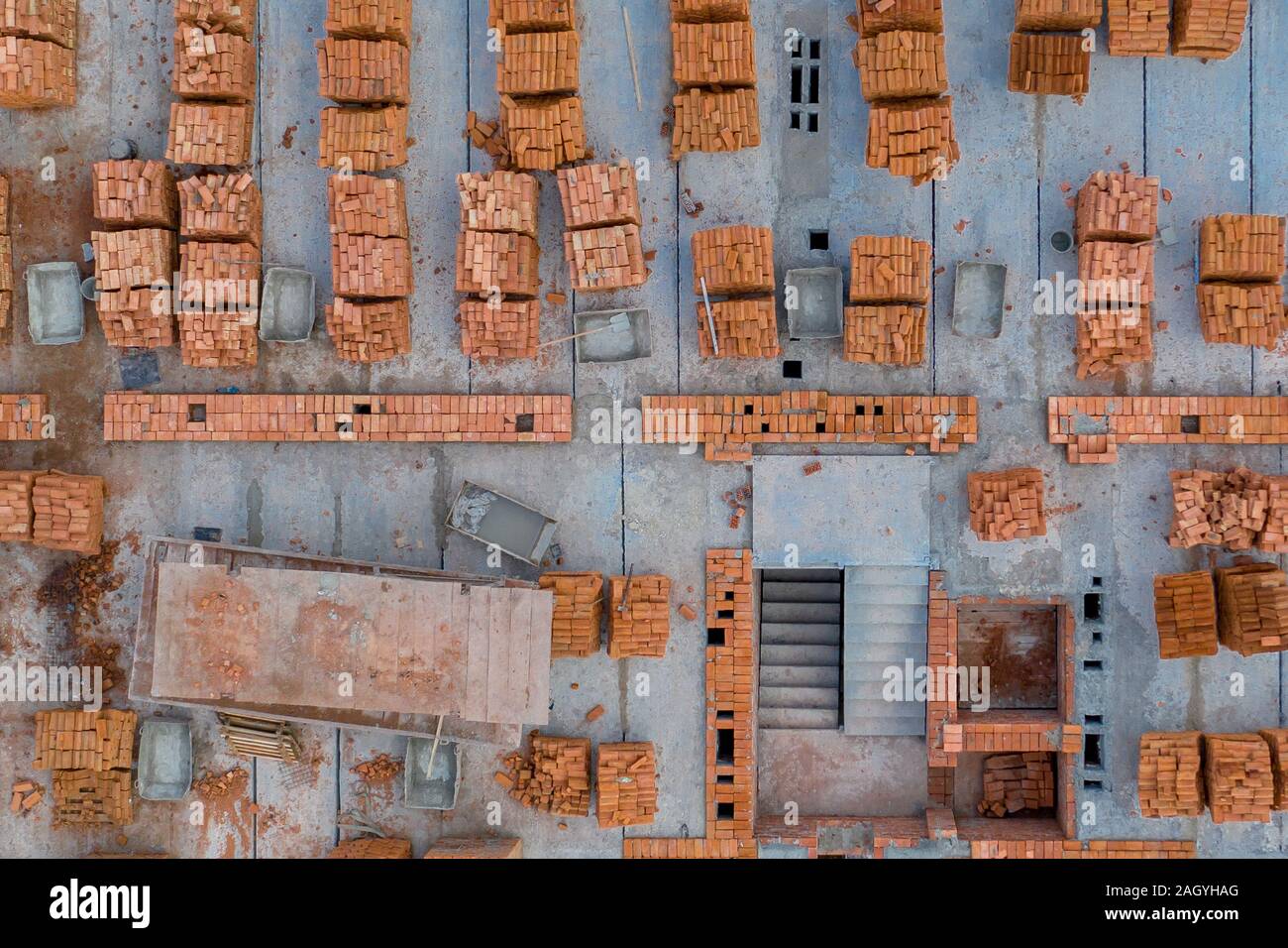 Pallets of clay brick stored for building construction. Construction ...
