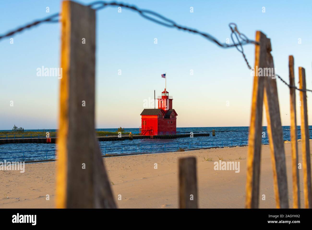 Beautiful sunrise at Holland State Park beach with view of Big Red ...