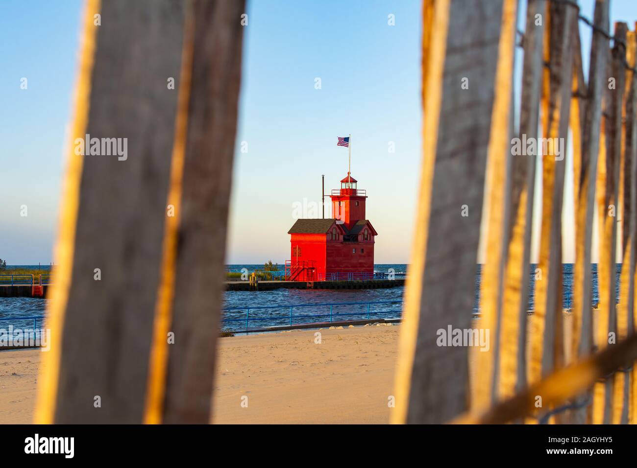 Beautiful sunrise at Holland State Park beach with view of Big Red ...