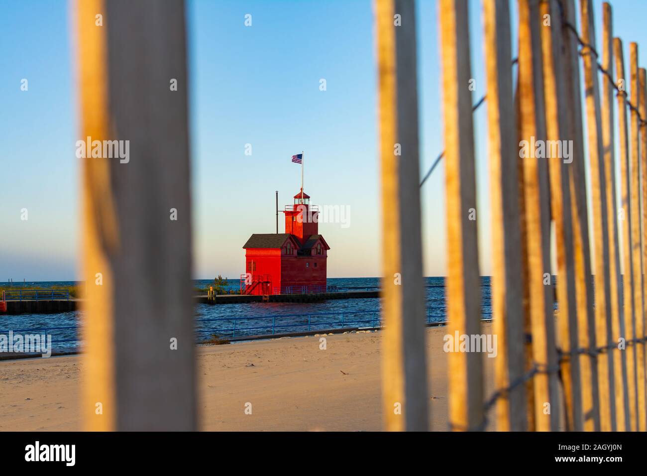 Beautiful sunrise at Holland State Park beach with view of Big Red ...