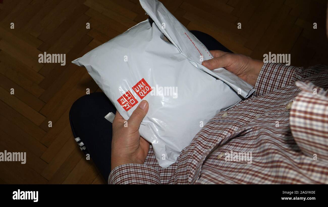 Paris, France - Circa 2019: Senior man unboxing unpacking plastic ...
