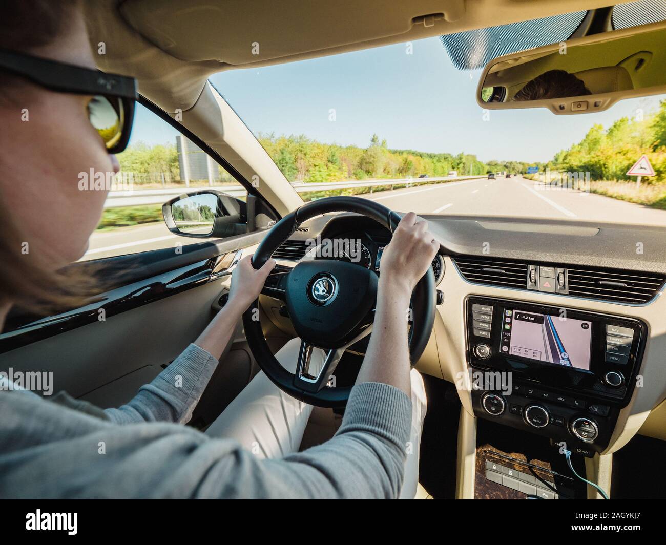 Lyon, France - Sep 8, 2019: Rear view of woman driving in fast car on ...