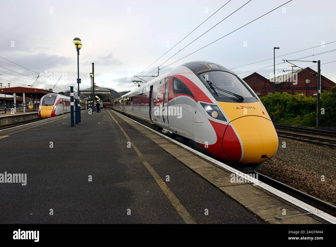 Three LNER Azuma high speed trains wait at the platforms at York ...