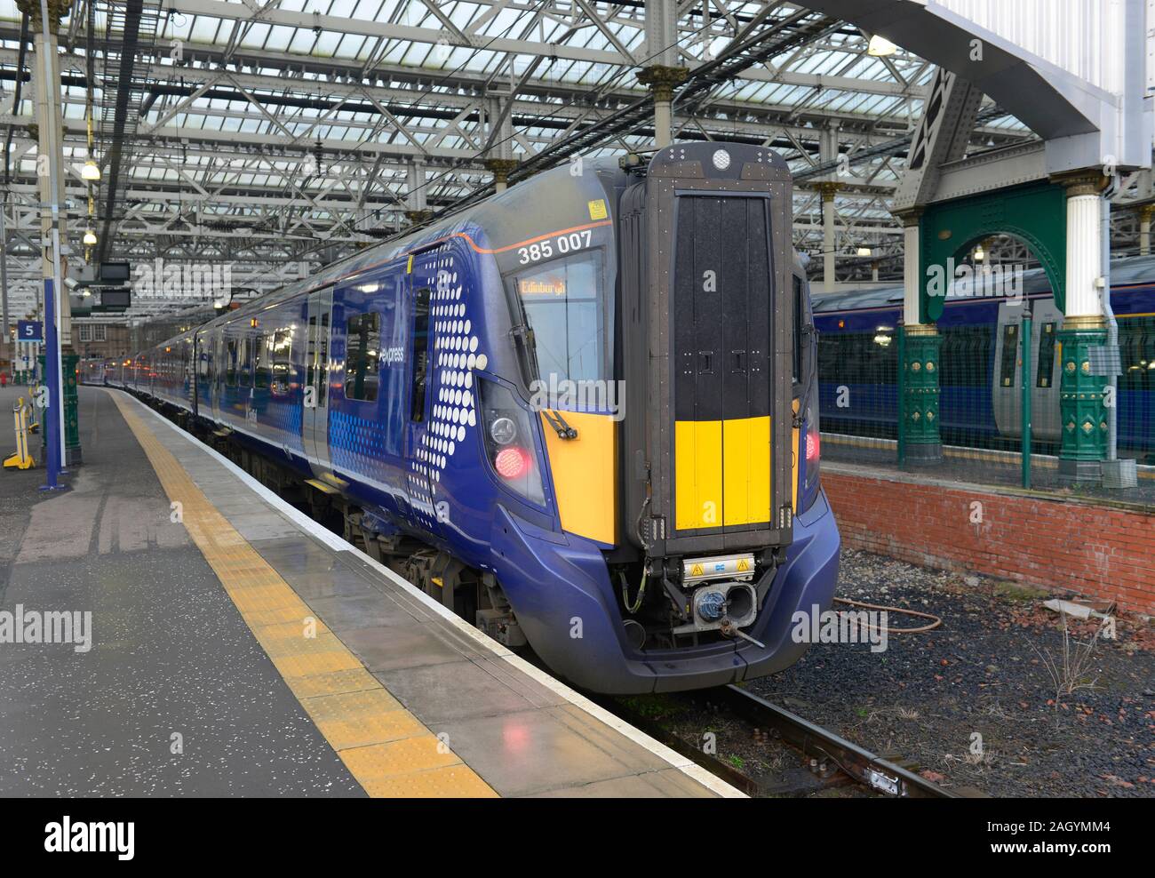 A Scotrail EMU train stands at the platform at Edinburgh Waverley ...