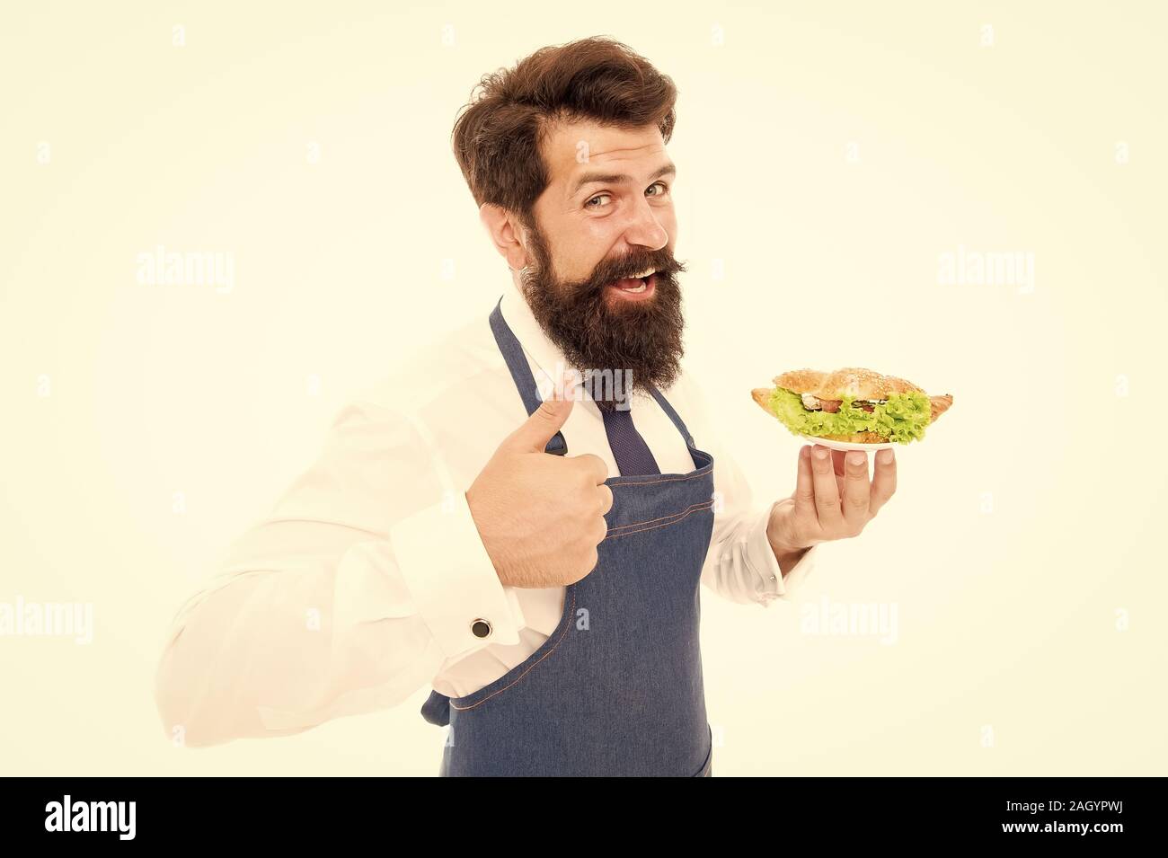 Delicious croissant. Cafe concept. Guy serving croissant stuffed with ...