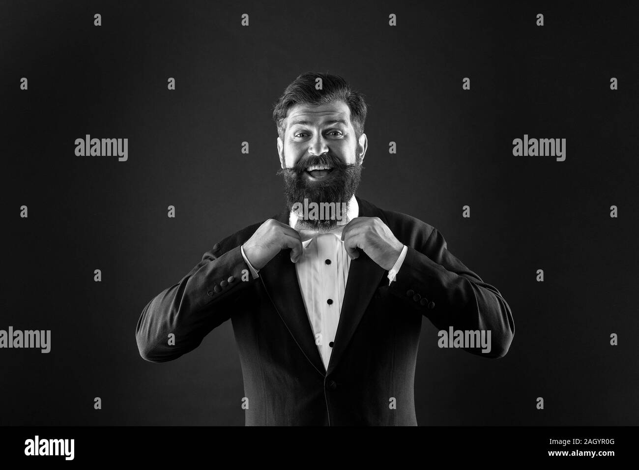 Classic and fashionable. Happy groom fix fashionable bow tie. Bearded ...