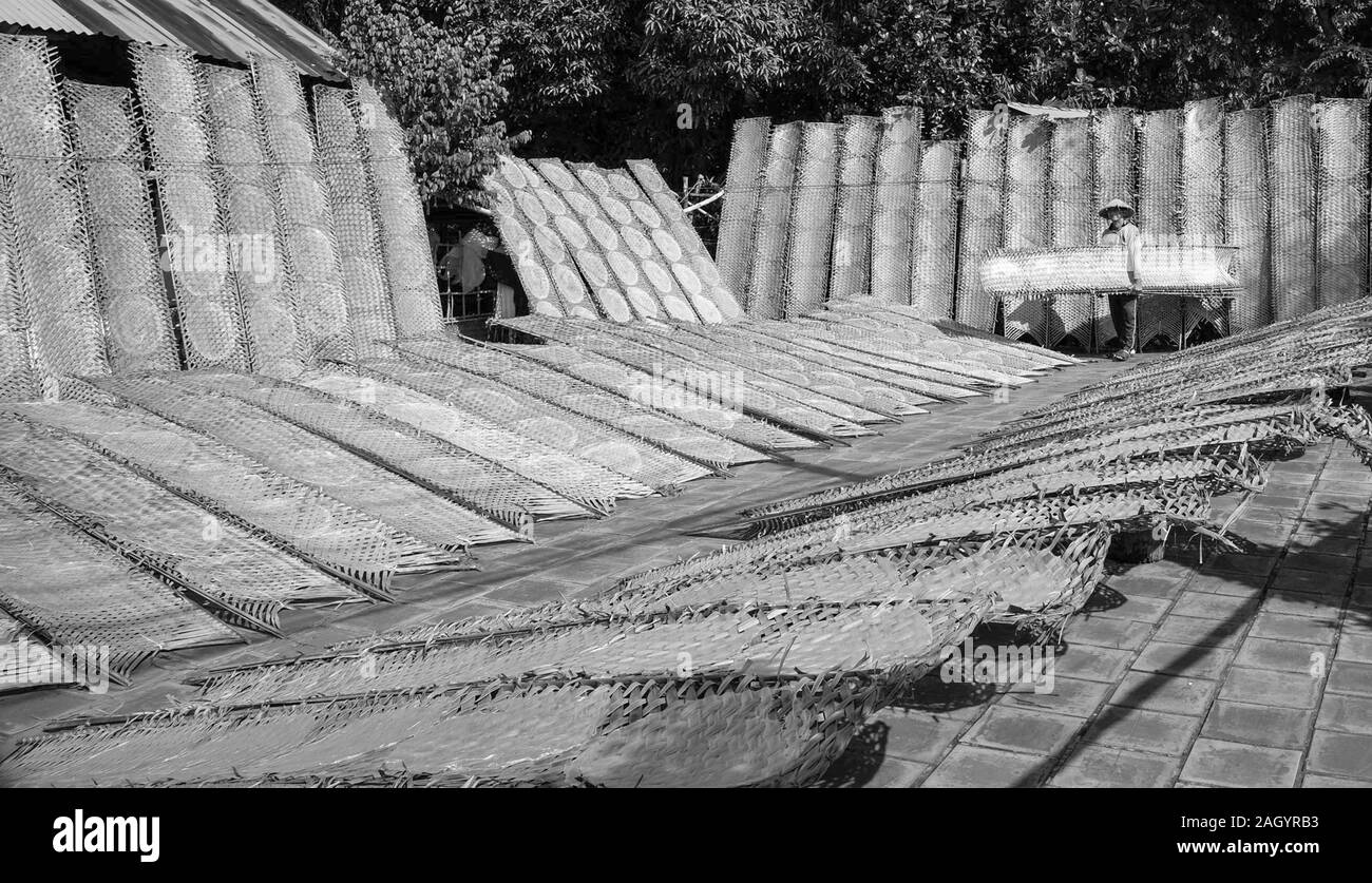 Man drying rice paper Stock Photo - Alamy