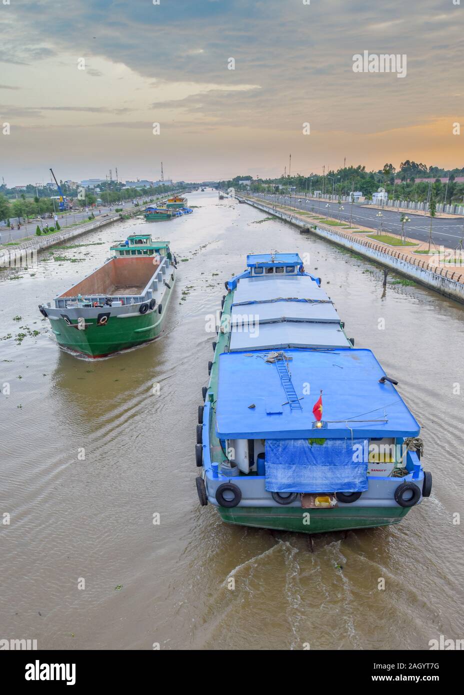 boat carry fruit on Xa No river in Hau Giang Stock Photo - Alamy