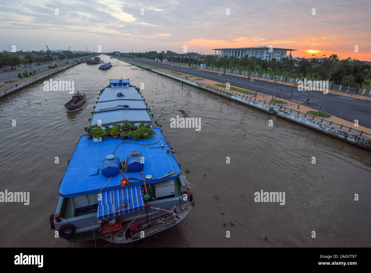boat carry fruit on Xa No river in Hau Giang Stock Photo - Alamy