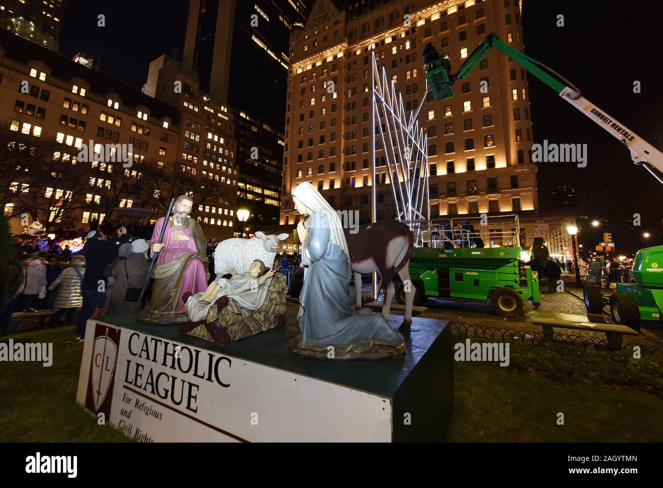 A nativity scene stands near the world’s largest Menorah as it is lit ...