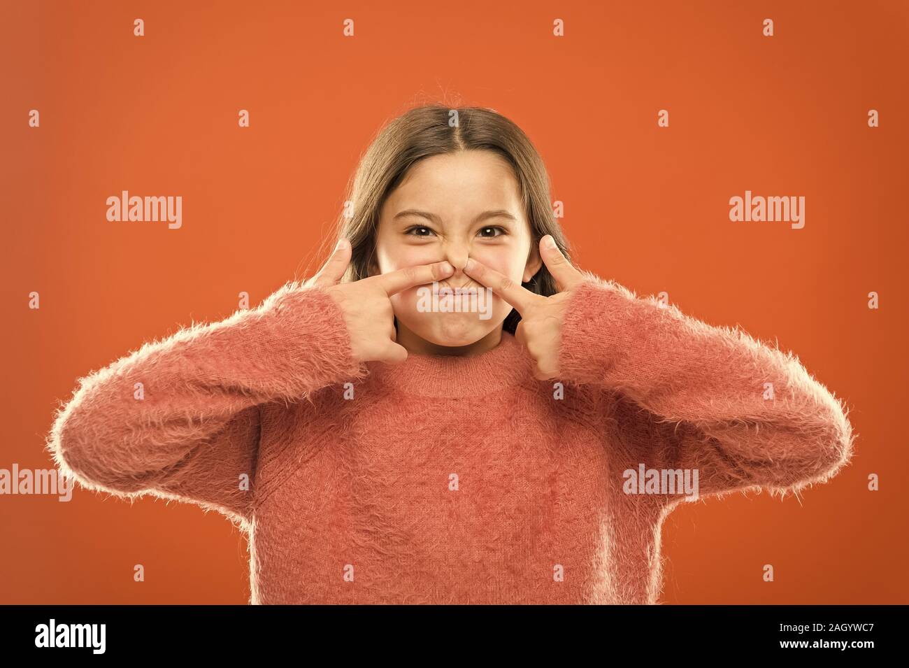Face fitness concept. Funny grimace. Kid demonstrate massage face skin ...