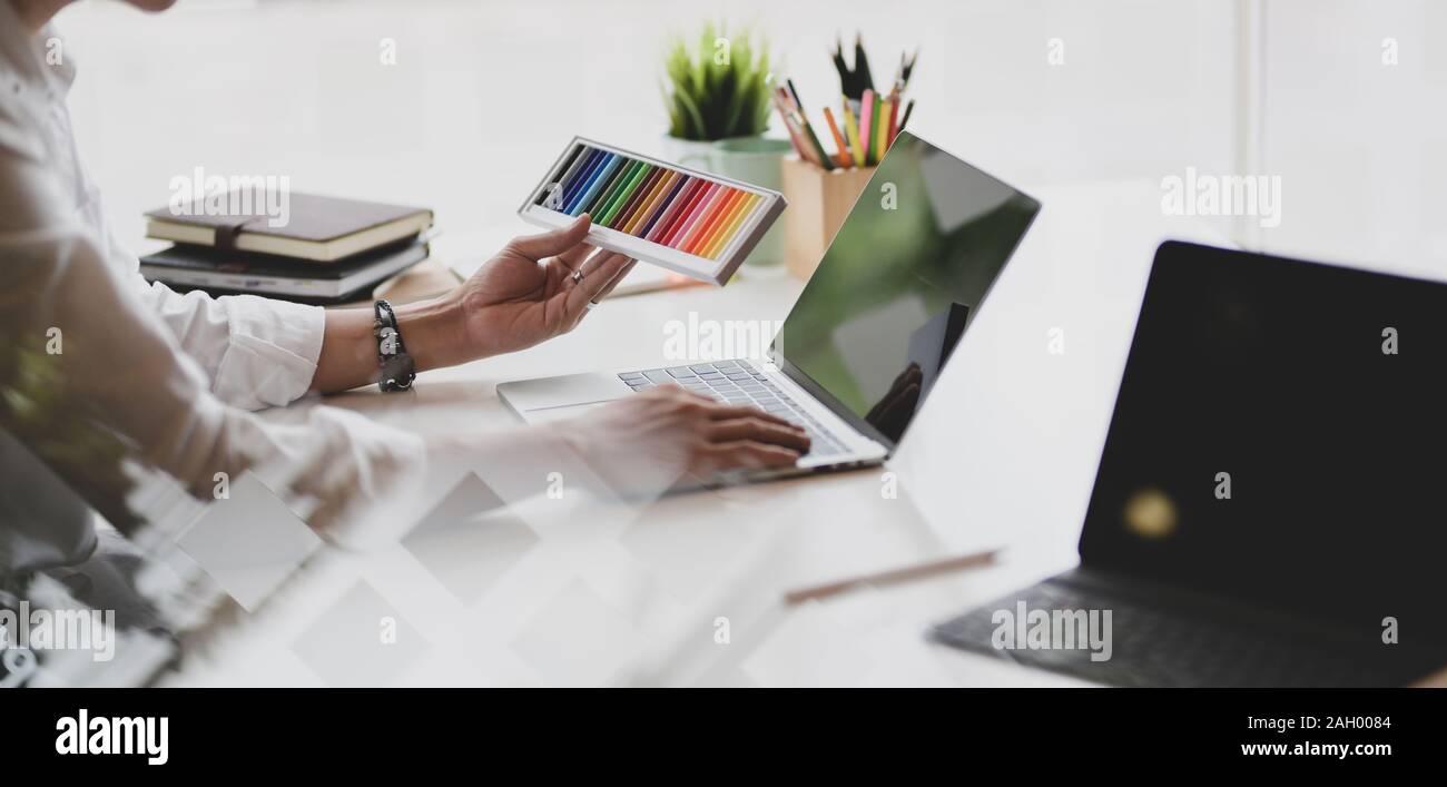 Cropped shot of young designer team working on their concept together ...