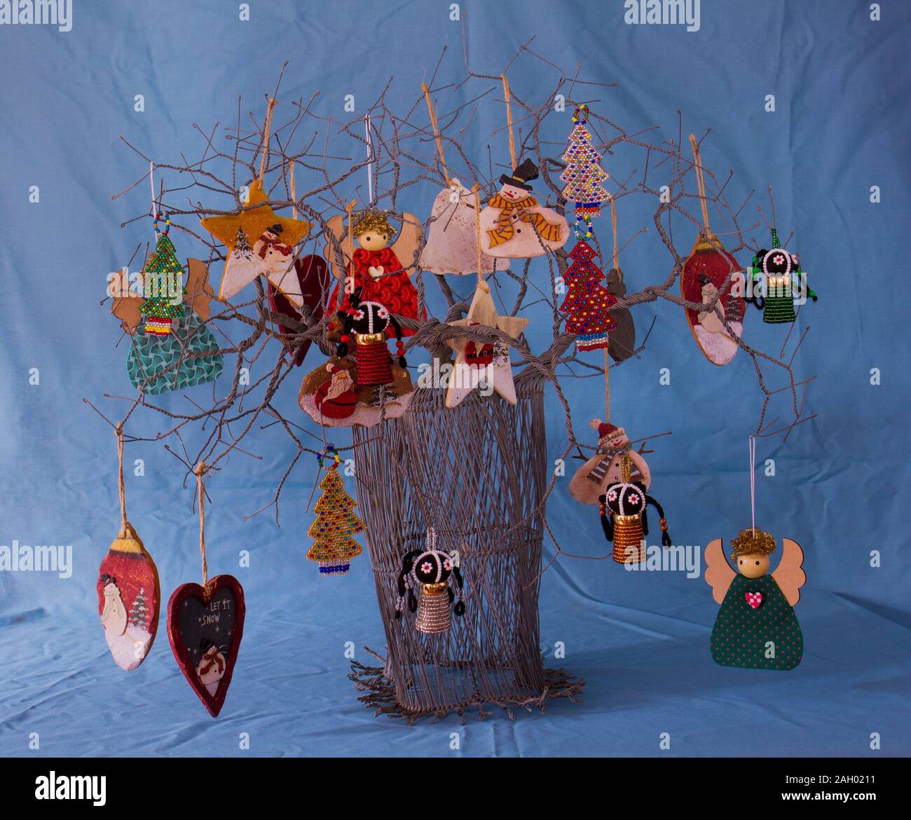 A handmade wire African art Christmas tree with decorations image in ...
