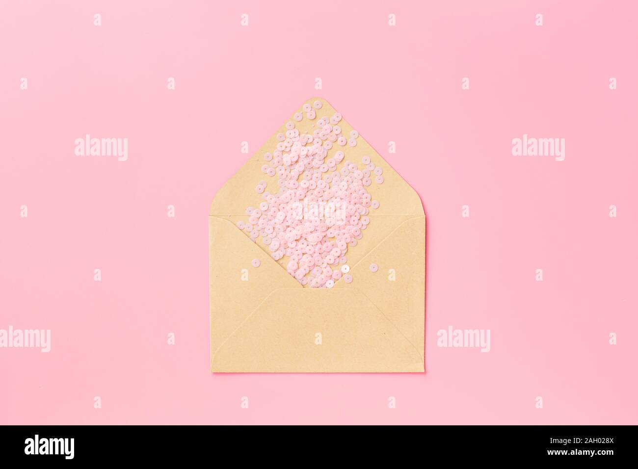 Pink Confetti explosion from envelope on pink paper background. Festive ...
