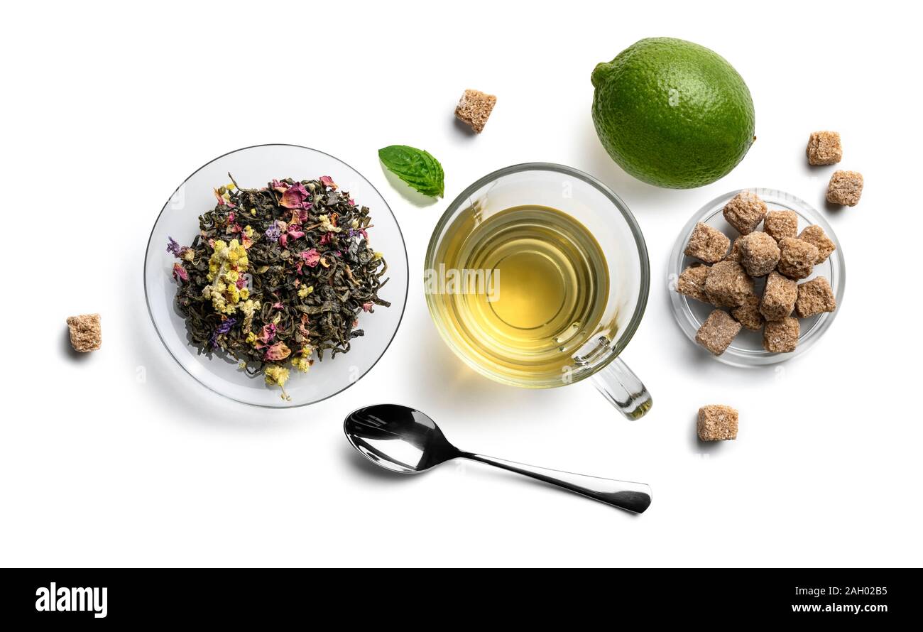 Green tea with natural aromatic additives and accessories. Top view on ...