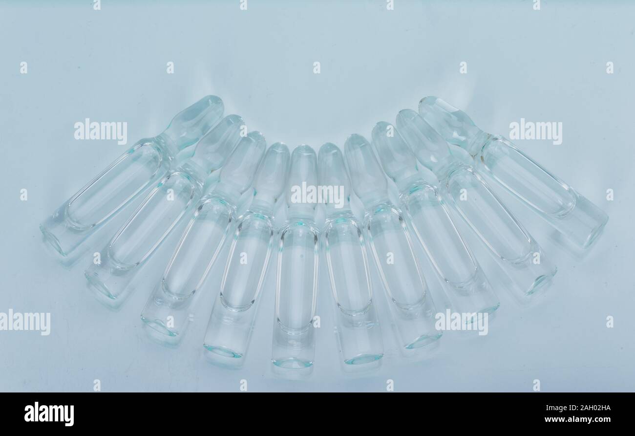 Glass medical ampoule vial for injection. Medicine is dry white drug ...