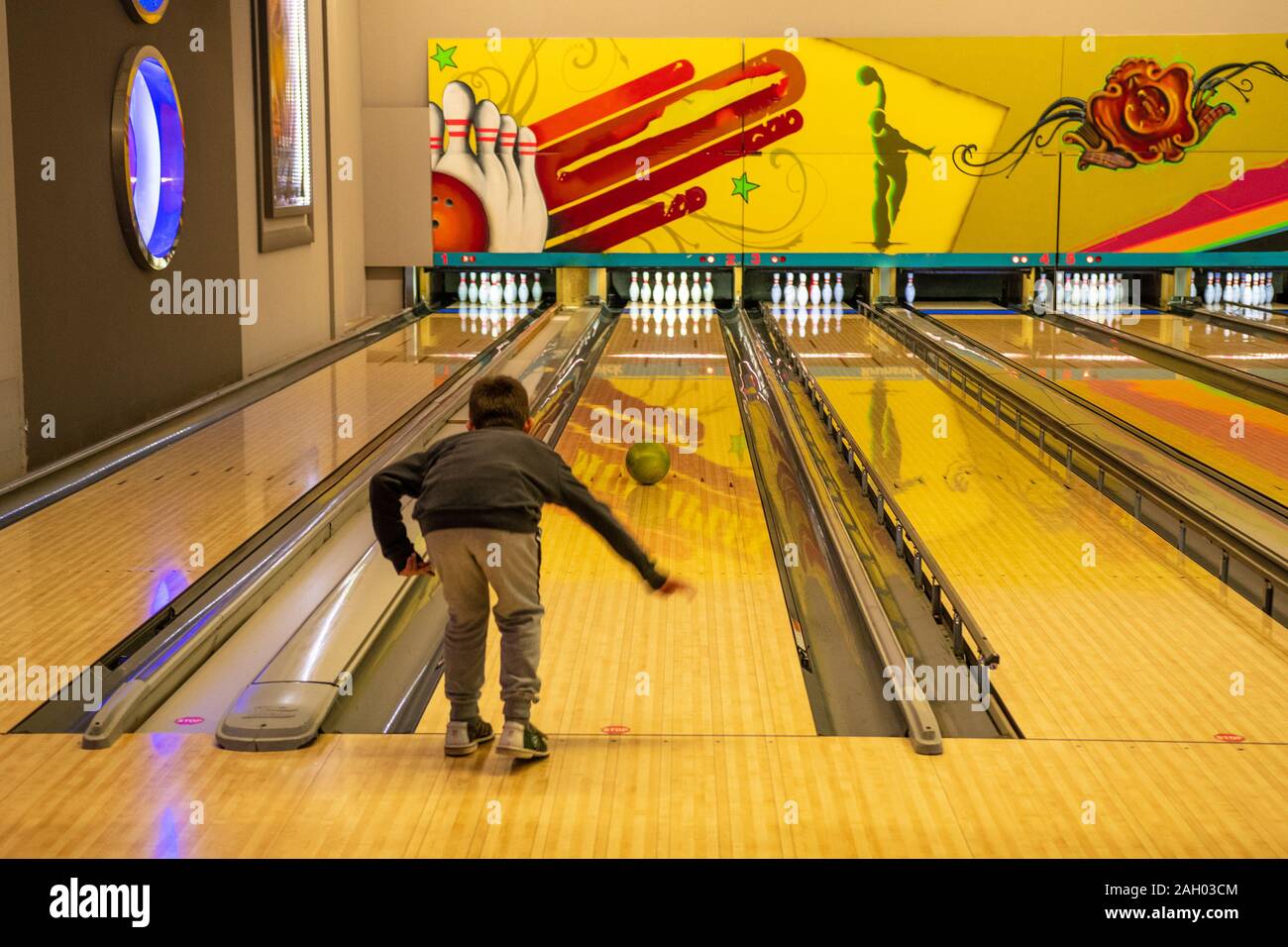 Beautiful scenery of school kids playing bowling at the sport club, kid ...