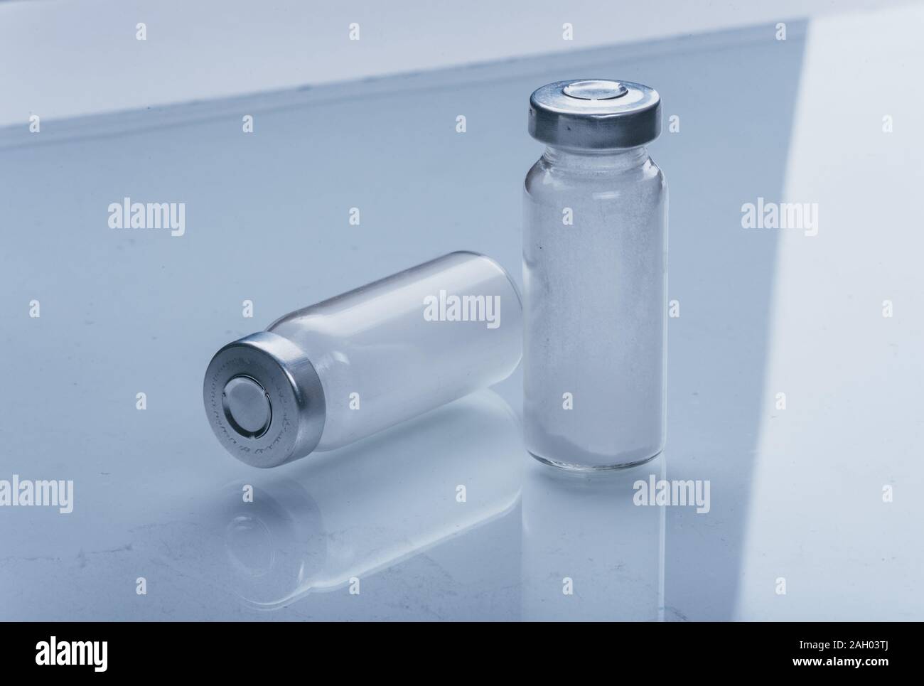 Glass medical ampoule vial for injection. Medicine is dry white drug ...