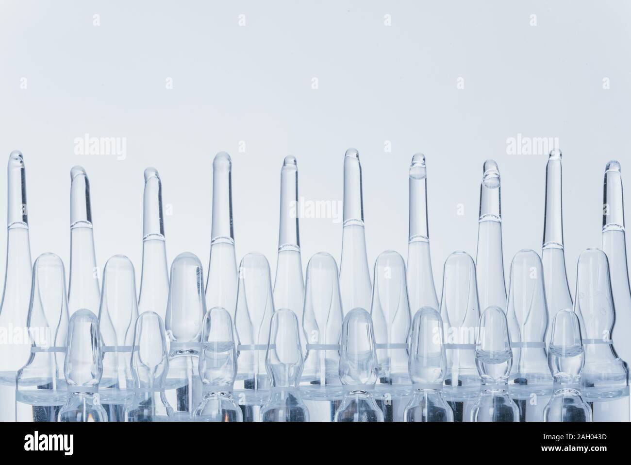 Glass medical ampoule vial for injection. Medicine is dry white drug ...