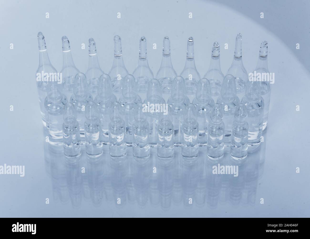 Glass medical ampoule vial for injection. Medicine is dry white drug ...