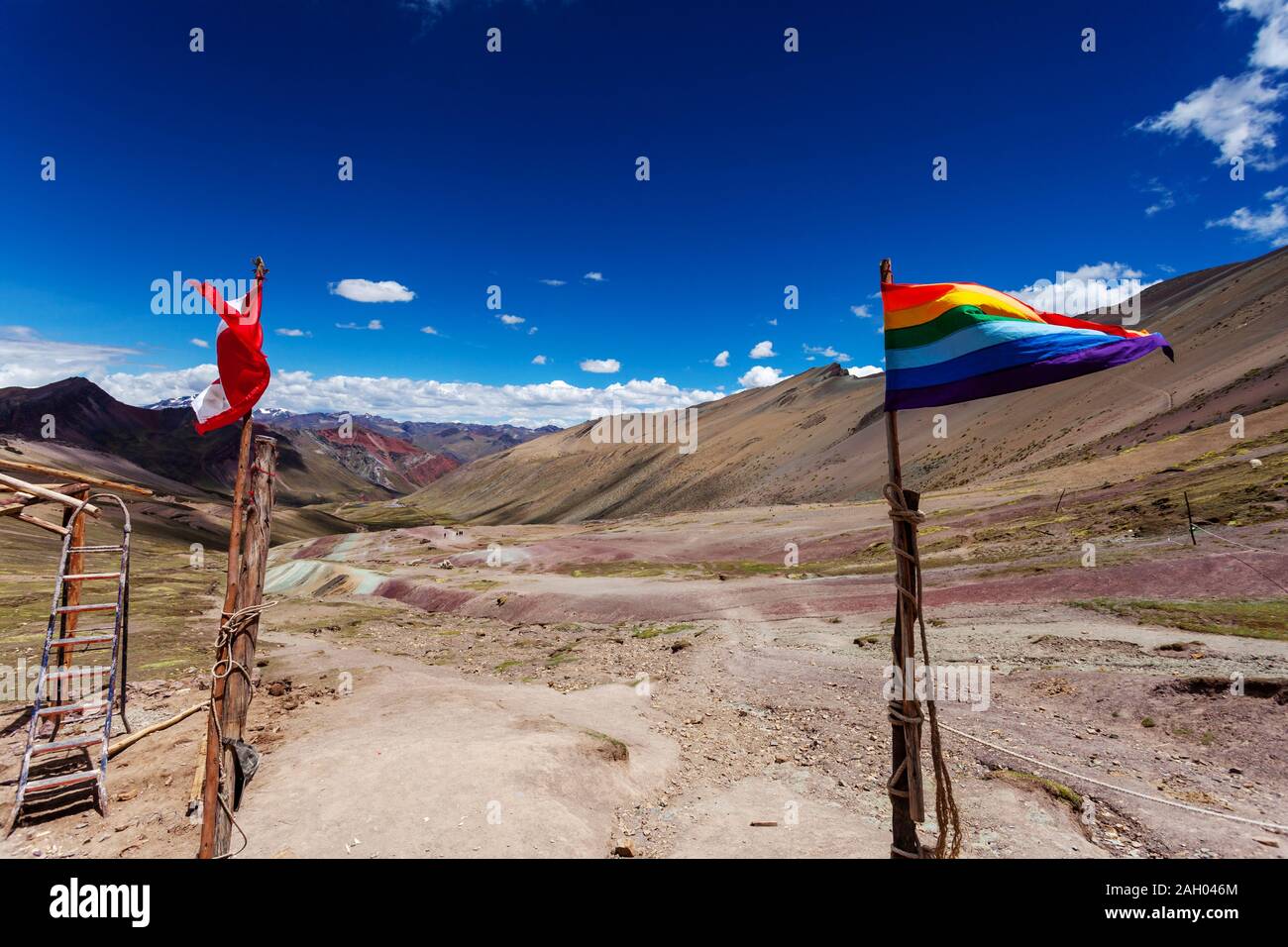 Peru flag and rainbow flag on rainbow Mountains Of Peru. Peruvian Andes ...