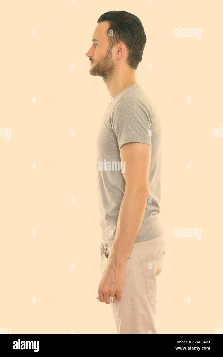 Profile view of young man standing Stock Photo - Alamy