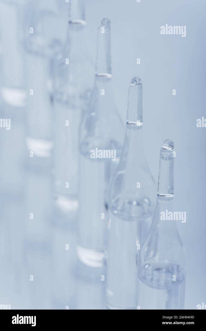 Glass medical ampoule vial for injection. Medicine is dry white drug ...