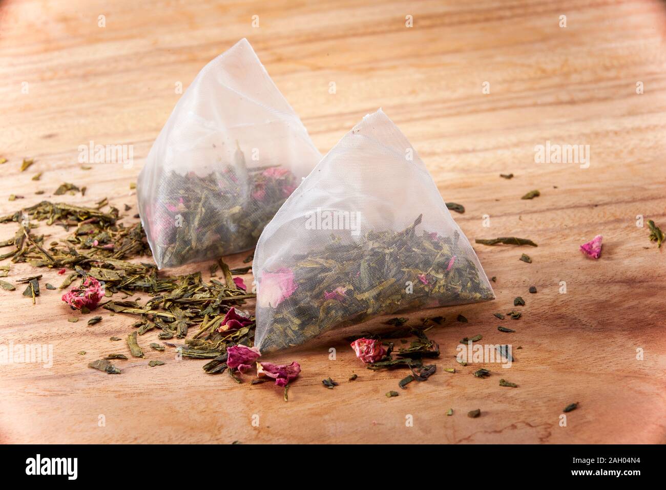 Two bags of cranberry green tea tea on the board Stock Photo - Alamy