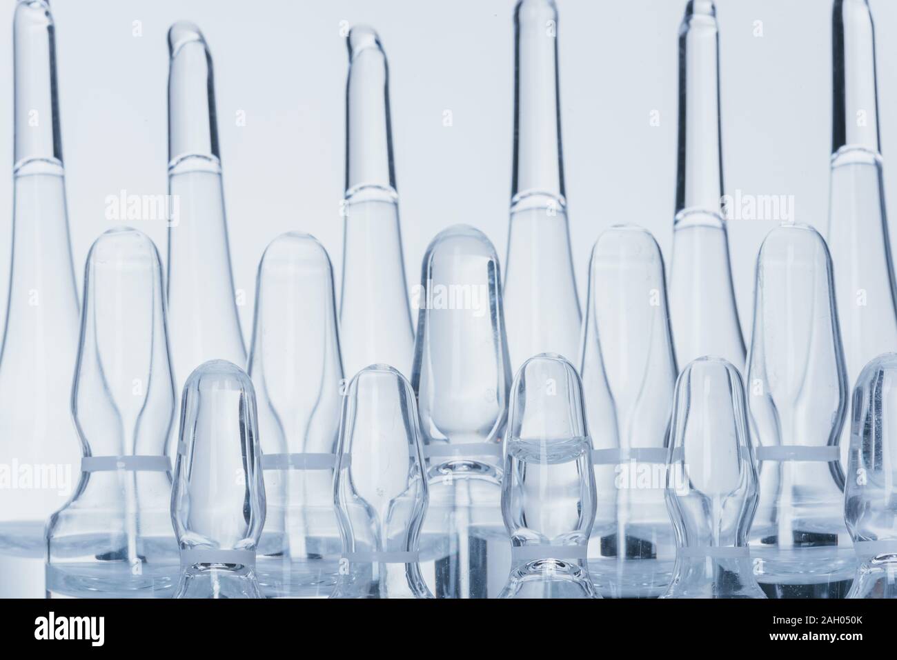 Glass medical ampoule vial for injection. Medicine is dry white drug ...