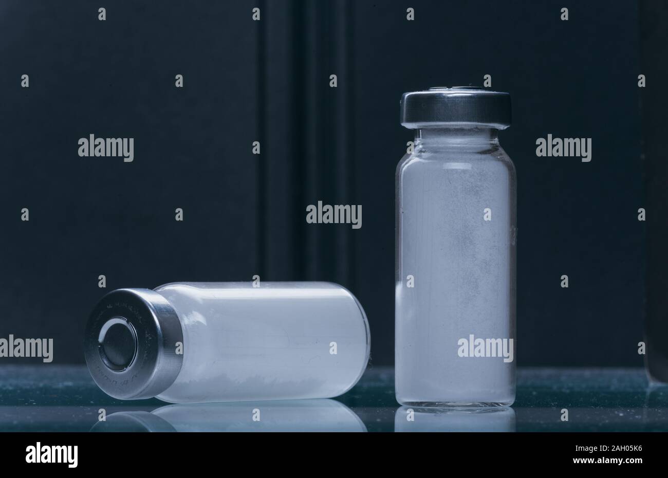 Glass medical ampoule vial for injection. Medicine is dry white drug ...