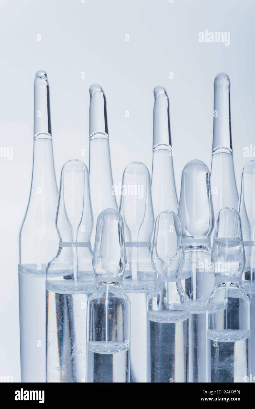 Glass medical ampoule vial for injection. Medicine is dry white drug ...