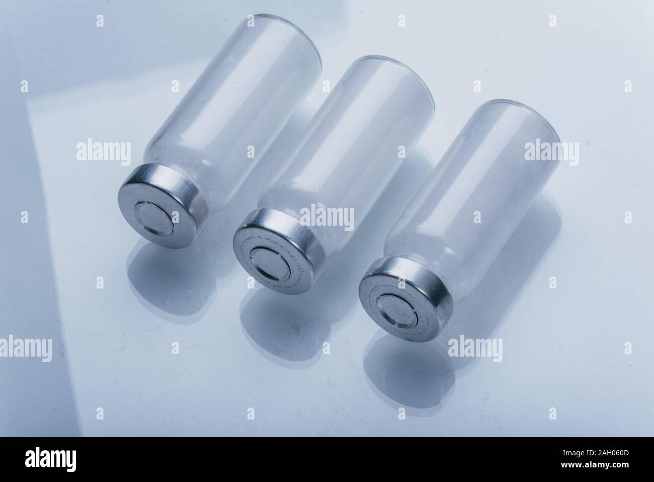 Glass medical ampoule vial for injection. Medicine is dry white drug ...