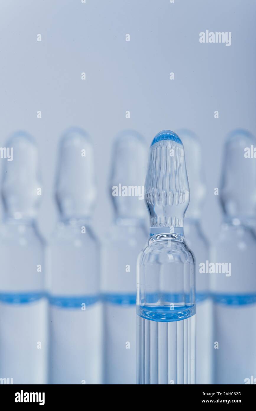 Glass medical ampoule vial for injection. Medicine is liquid sodium ...