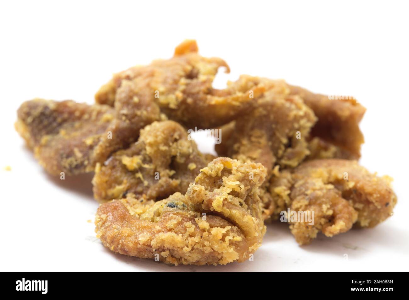 Fried Crispy Chiken Skin isolated on white background Stock Photo - Alamy